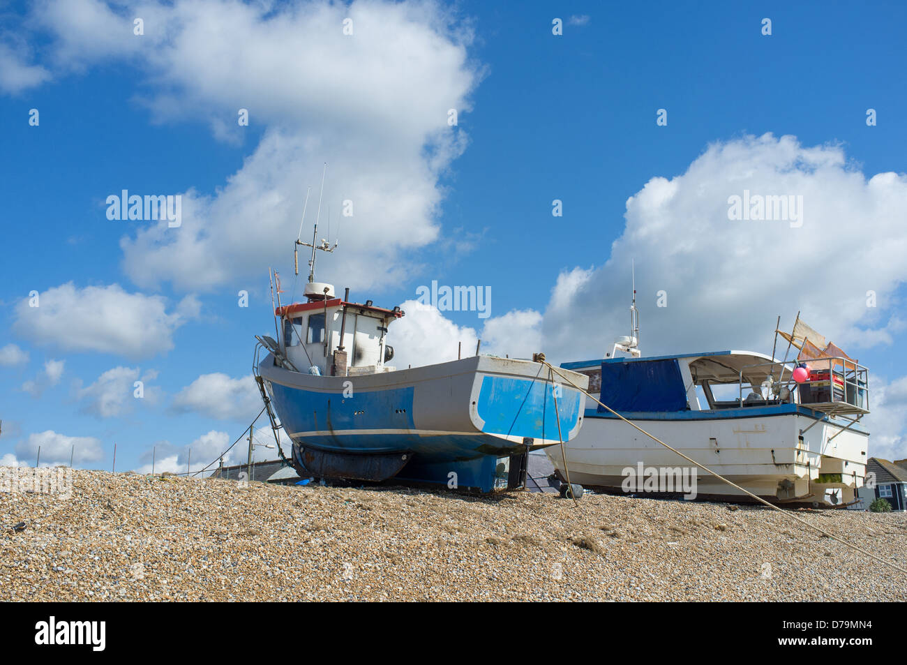 Fishing boats pulled up the beach and above the high tide line at Hythe ...