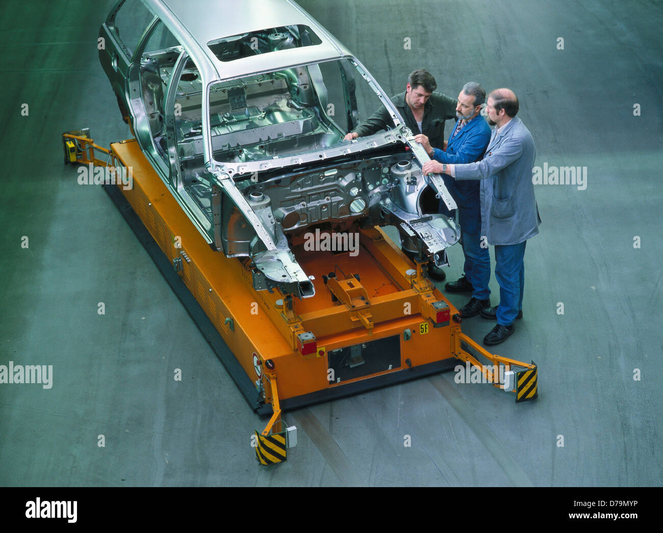 Car industry industrial supervisor foreman discussing production based ...