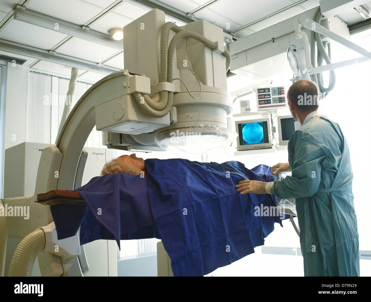 Patient undergoing angiography examination Stock Photo - Alamy