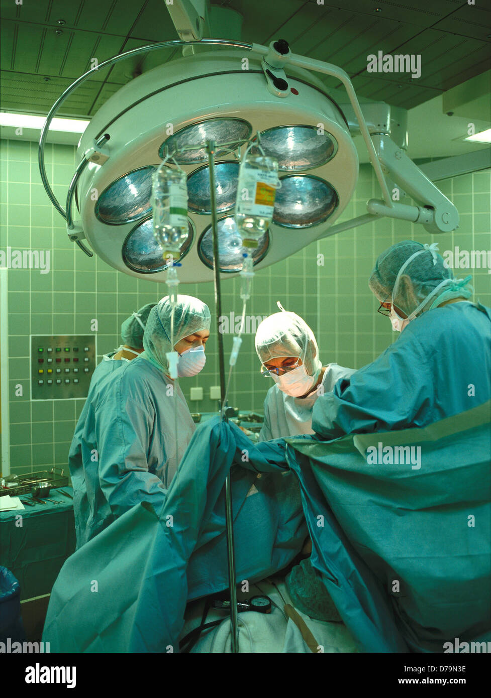 Team doctors performing heart operation Stock Photo - Alamy
