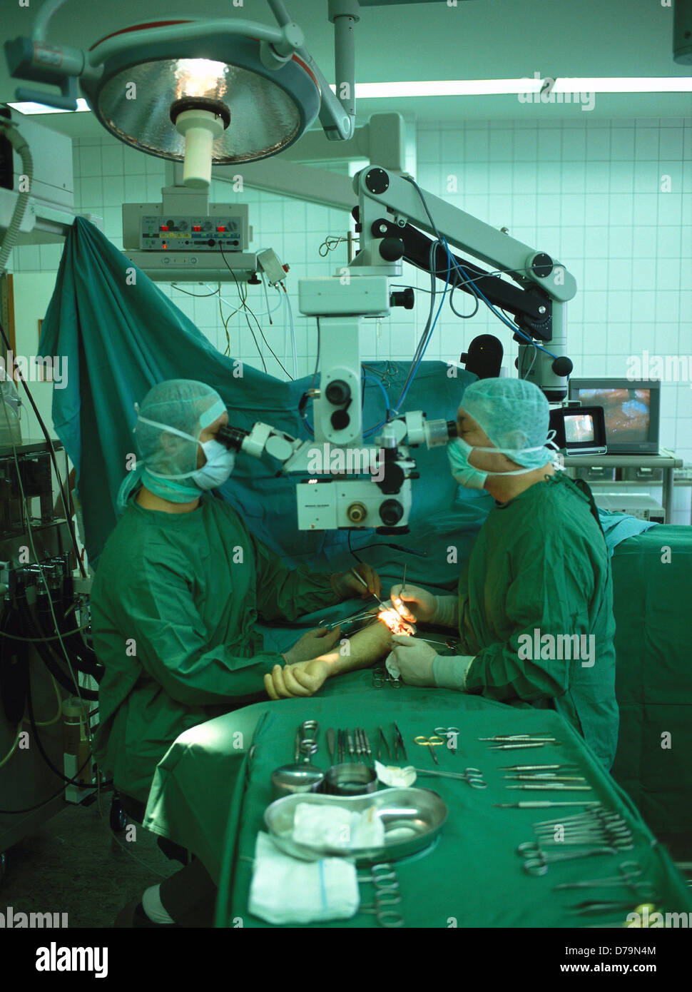 Surgeon performing microsurgical vascular operation Stock Photo - Alamy