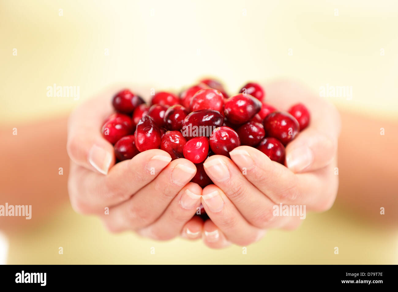 Cranberries. Woman showing cranberries. Healthy eating and berry ...