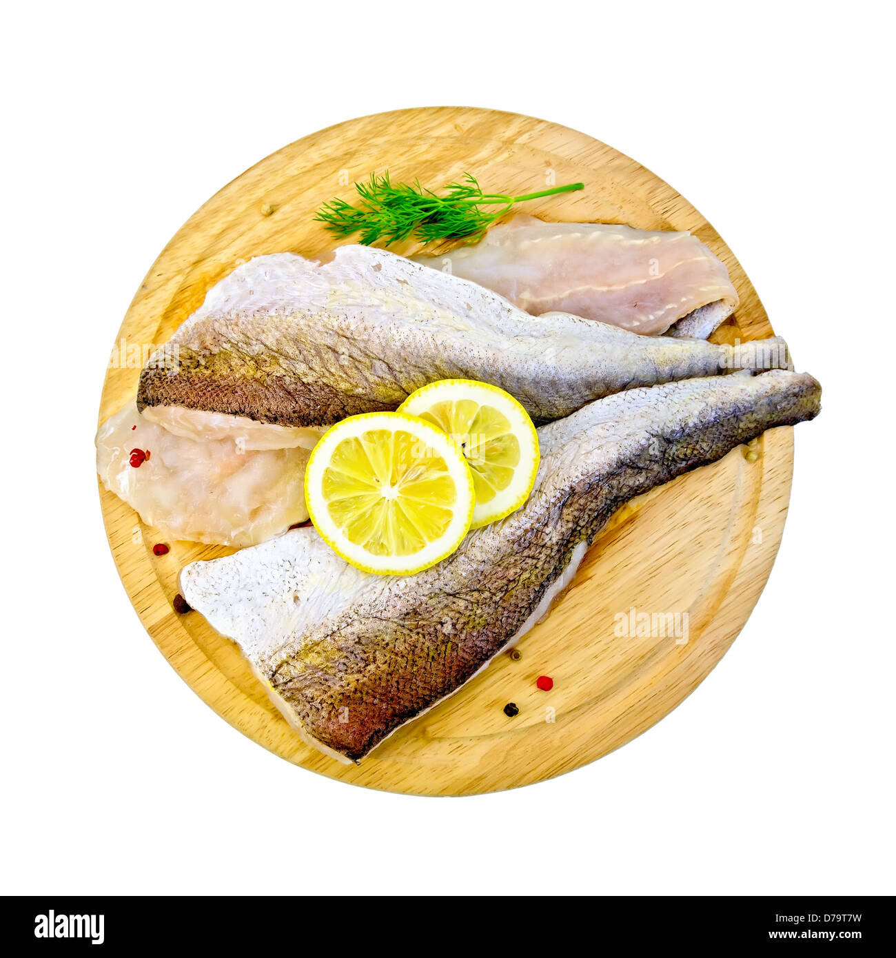 Fillet of cod on a round board with lemon and dill isolated on white ...