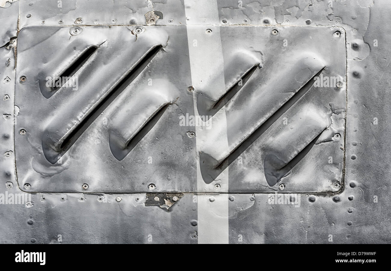 a vent panel from a military aircraft for use as a background for ...