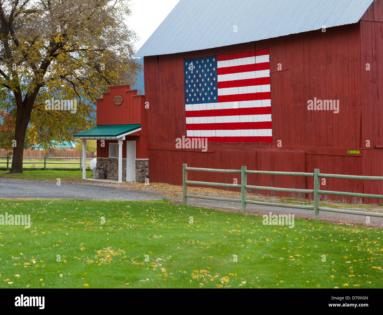 Chelan County, Washington: Historic red barn with an American flag ...