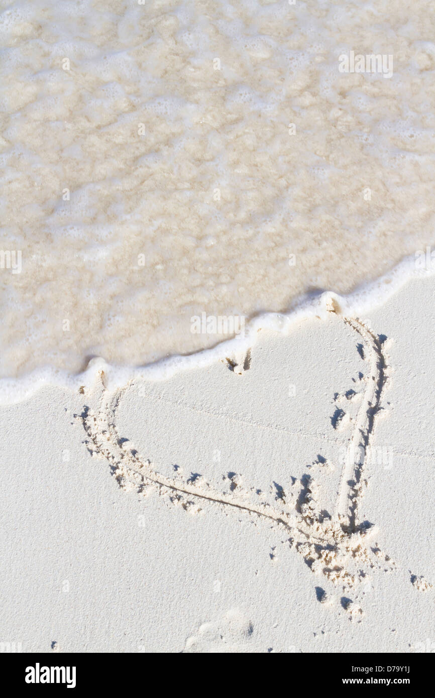 Heart drawing on the beach with wave Stock Photo - Alamy
