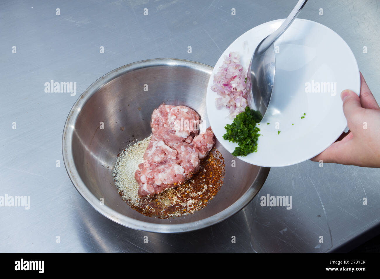 How to make spicy pork cubes Stock Photo - Alamy