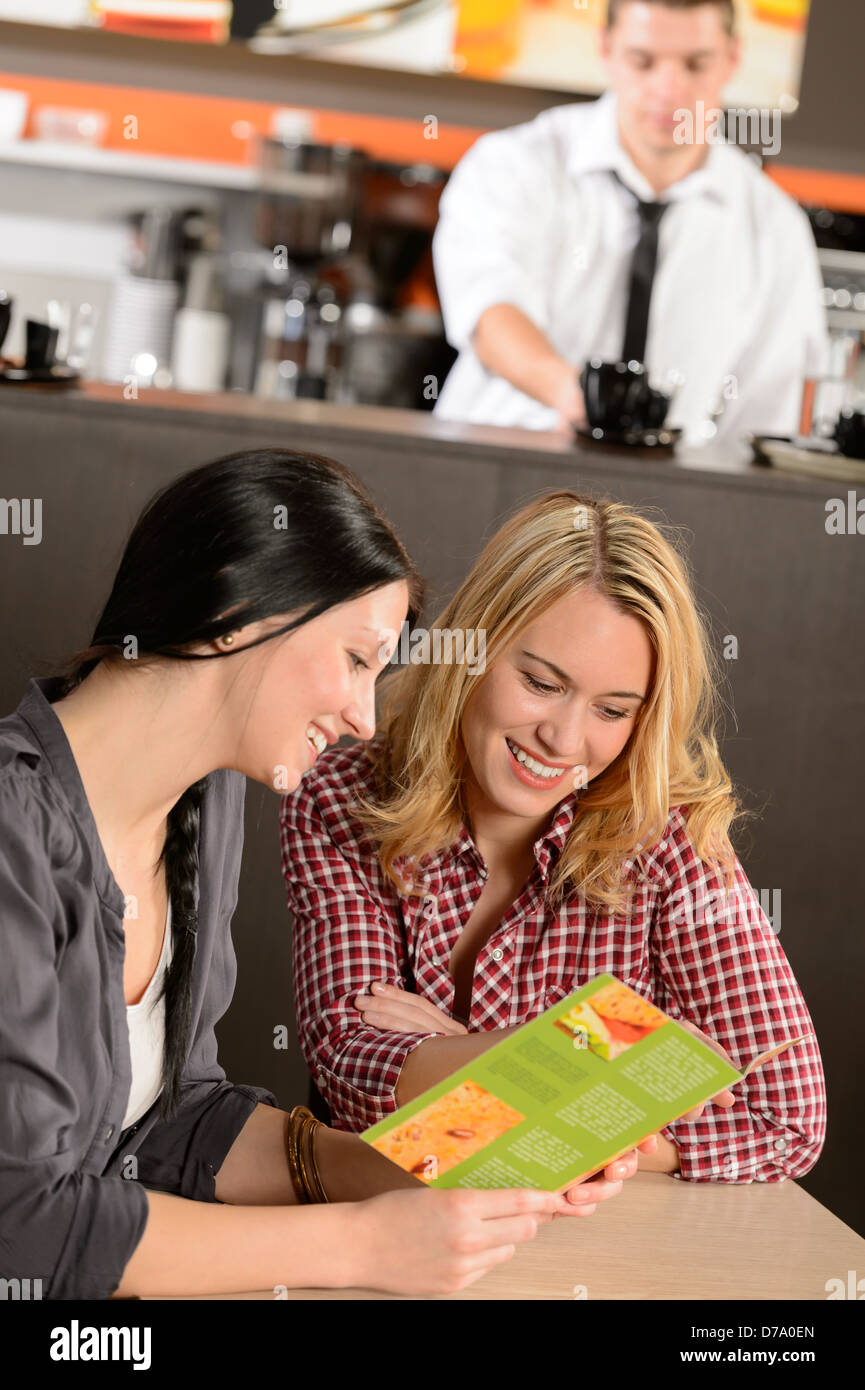 Women reading restaurant menu hi-res stock photography and images - Alamy