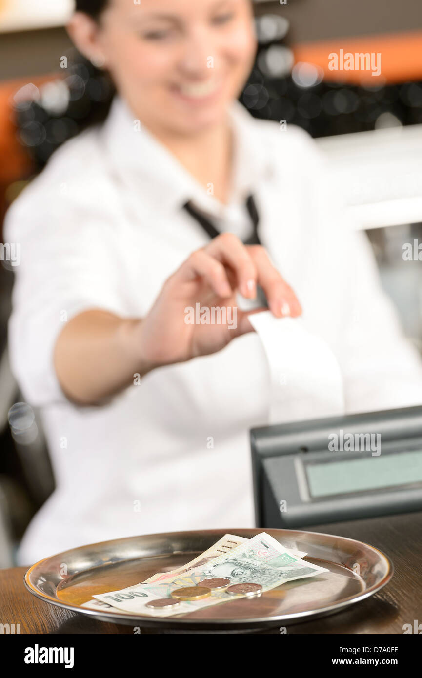 Cash and young cashier giving receipt in bar CZK Stock Photo - Alamy