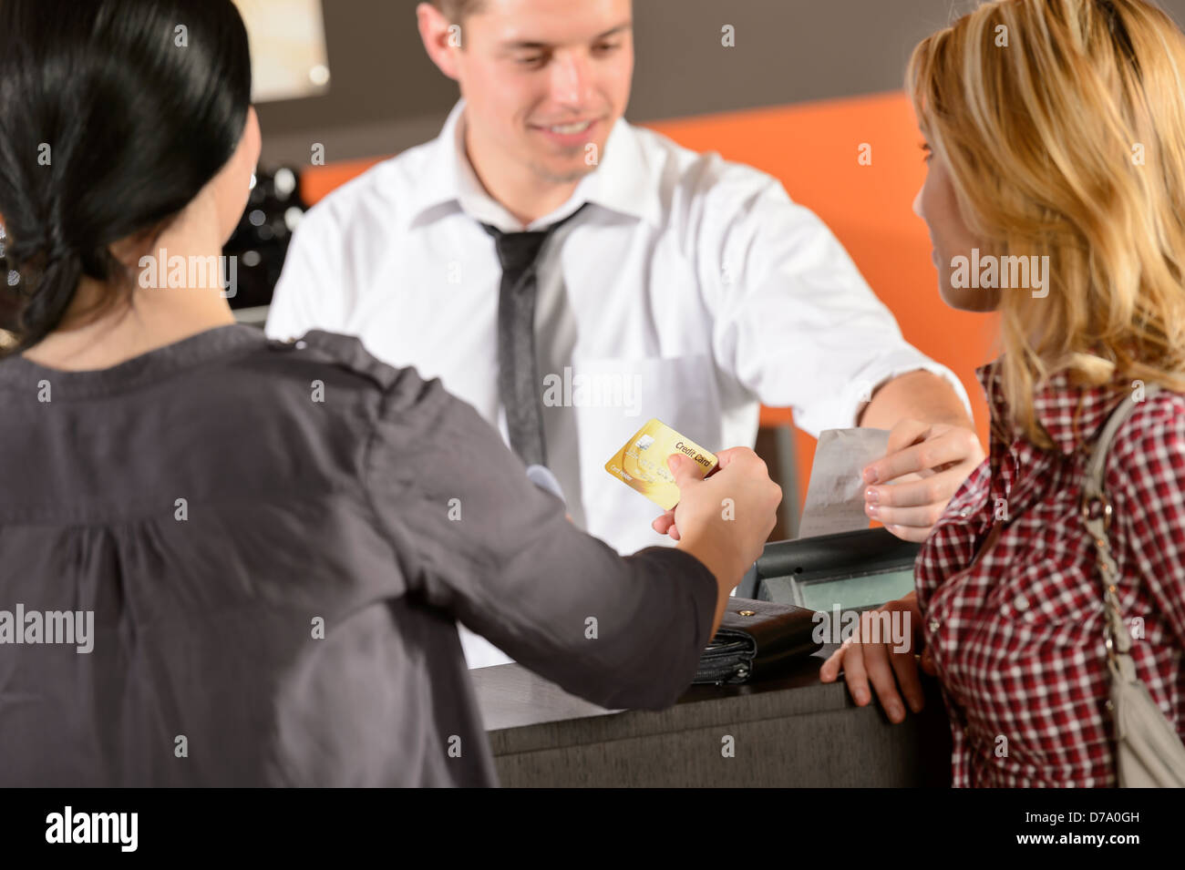 Customers paying by credit card in pub Stock Photo - Alamy
