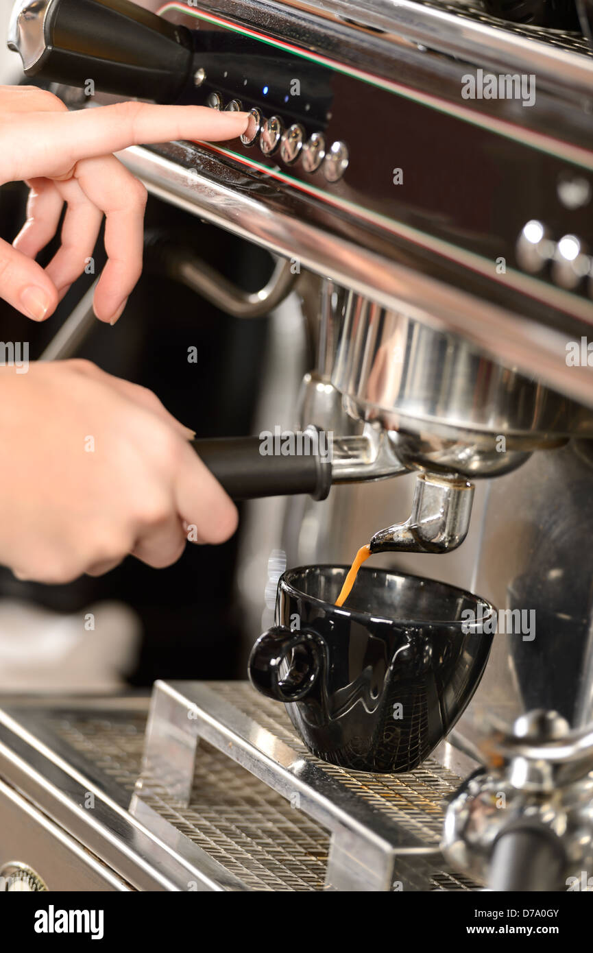 Close up of hands making coffee with espresso machine Stock Photo - Alamy