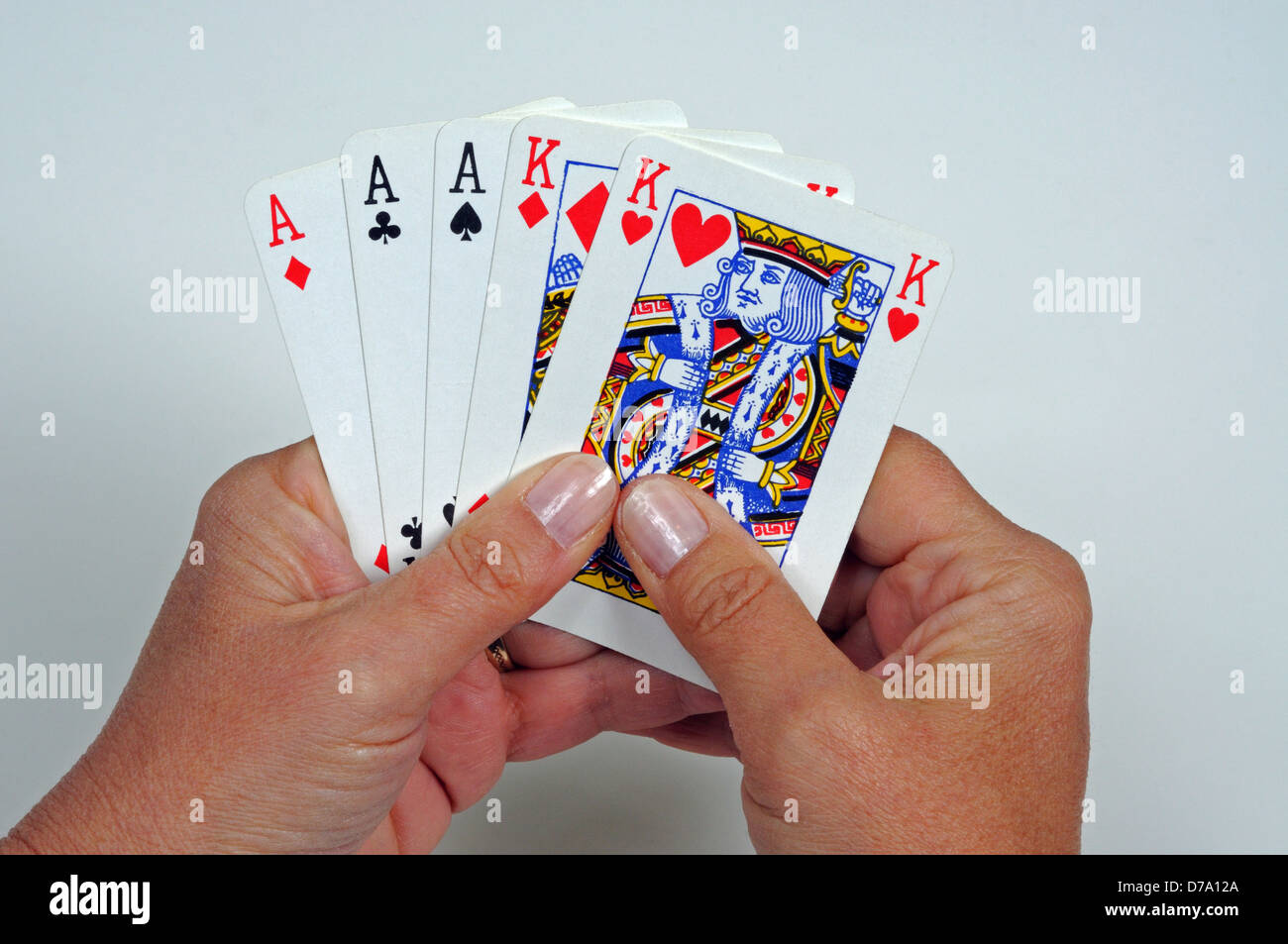 Full house poker hand Stock Photo - Alamy