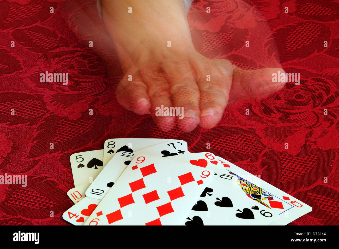 Woman playing snap against a red background Stock Photo - Alamy