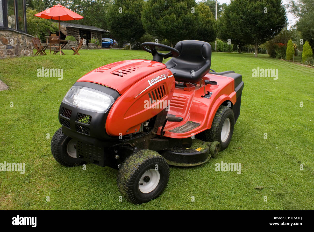 Red ride-on mower Stock Photo - Alamy