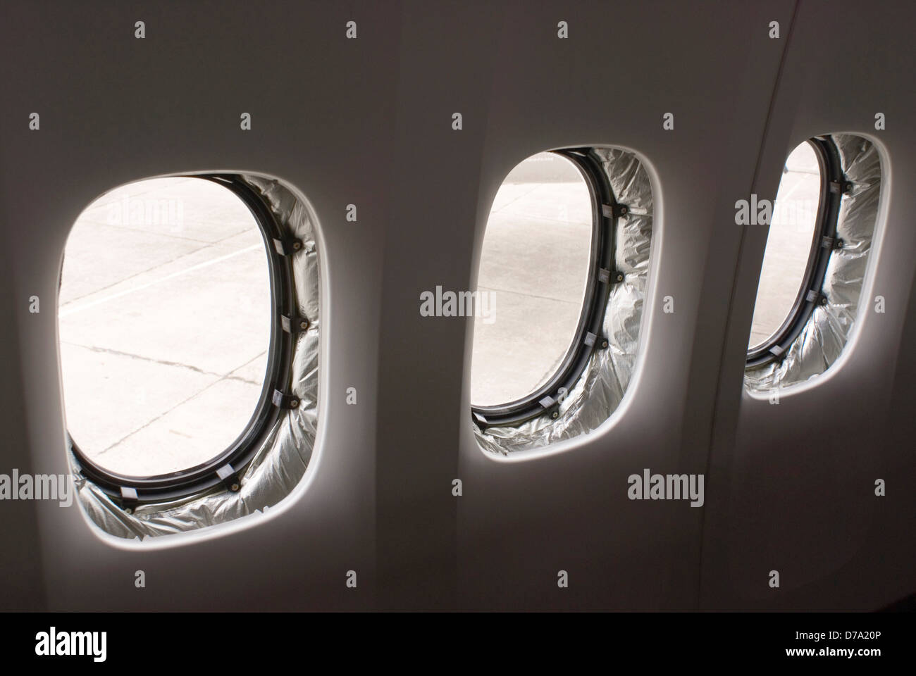 Aircraft windows showing insulation Stock Photo - Alamy