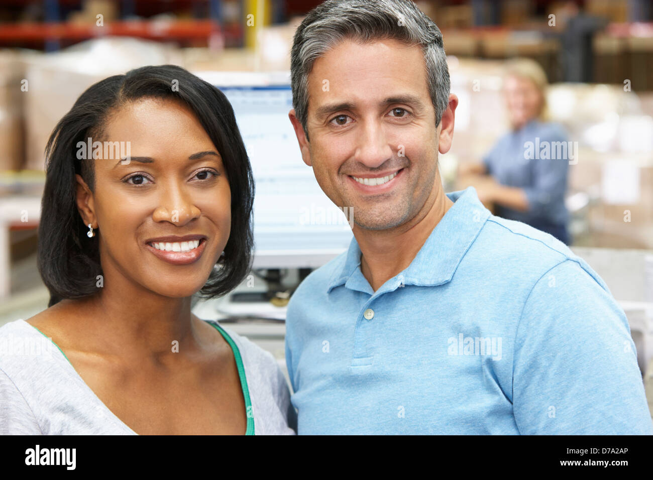 Two Workers At Computer Terminal In Distribution Warehouse Stock Photo ...