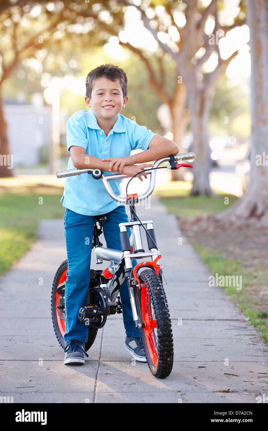 Boy Riding Bike On Path Stock Photo - Alamy