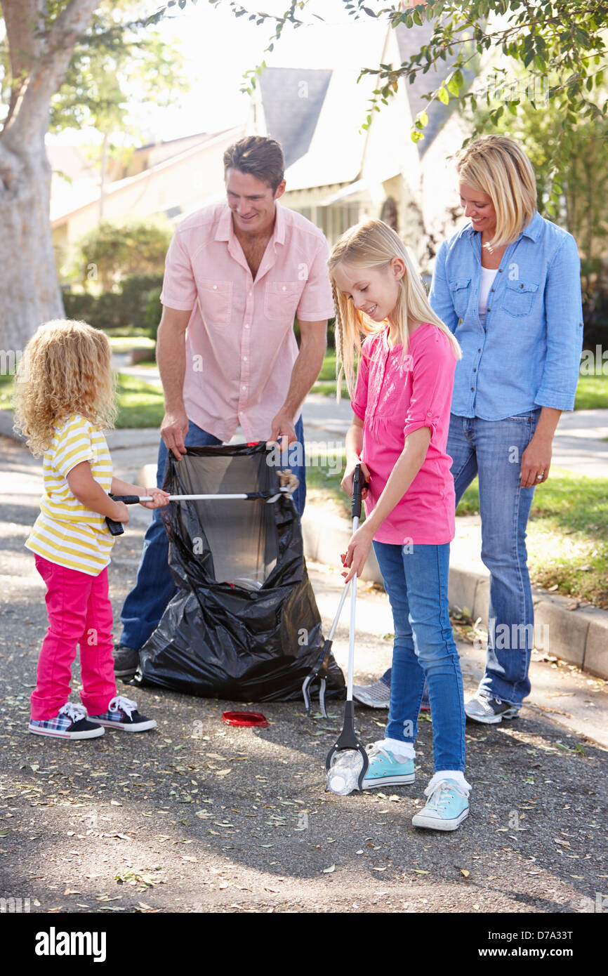 Family Picking Up Litter In Suburban Street Stock Photo - Alamy