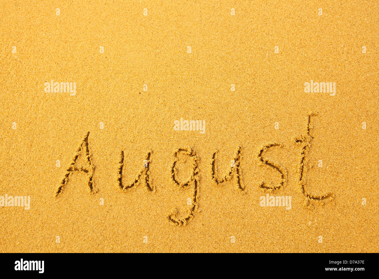 August - written in sand on beach texture (for background Stock Photo ...