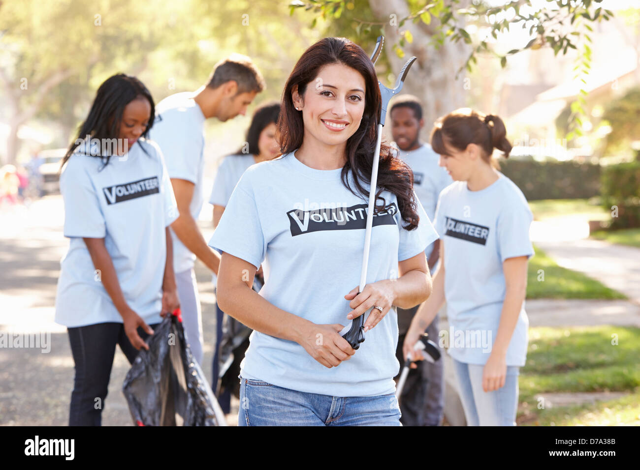 Team Of Volunteers Picking Up Litter In Suburban Street Stock Photo - Alamy