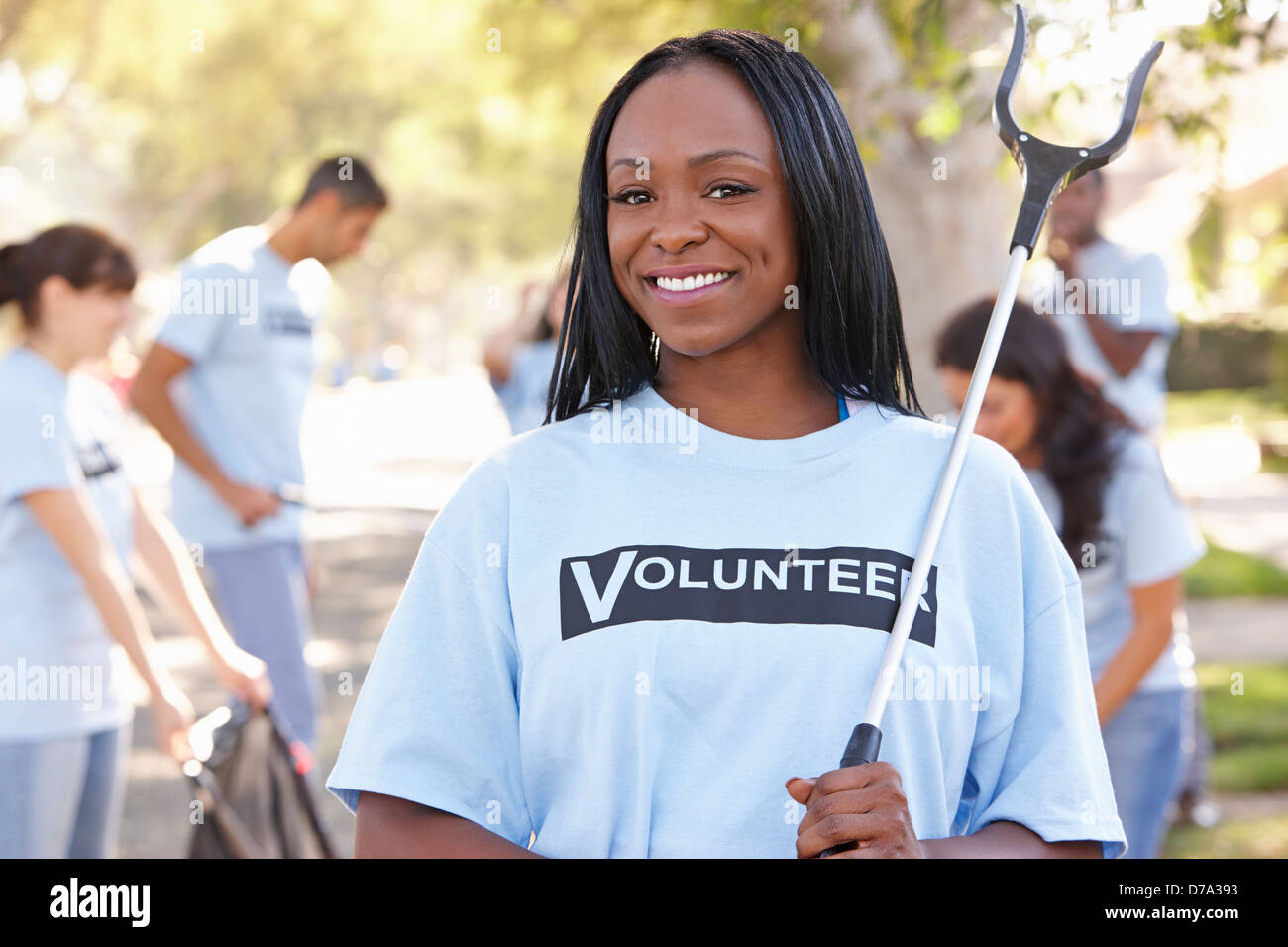 Team Of Volunteers Picking Up Litter In Suburban Street Stock Photo - Alamy