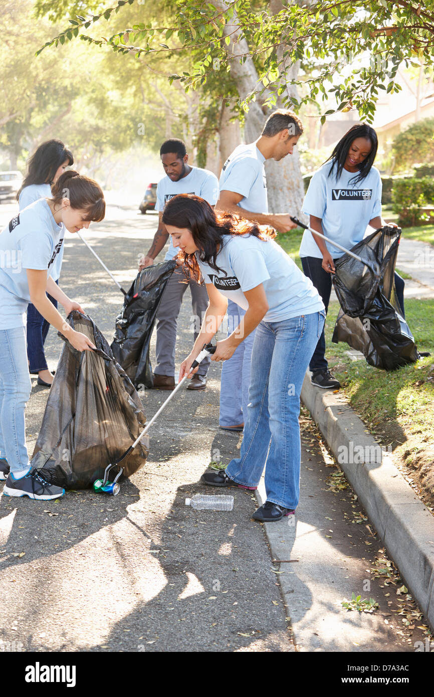 Team Of Volunteers Picking Up Litter In Suburban Street Stock Photo - Alamy
