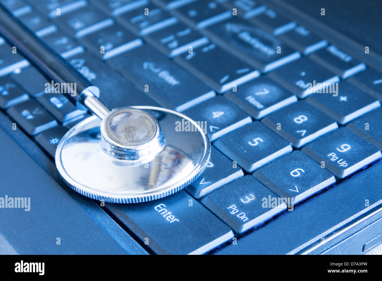 Stethoscope on keyboard (computer, laptop) close up. Medical education ...