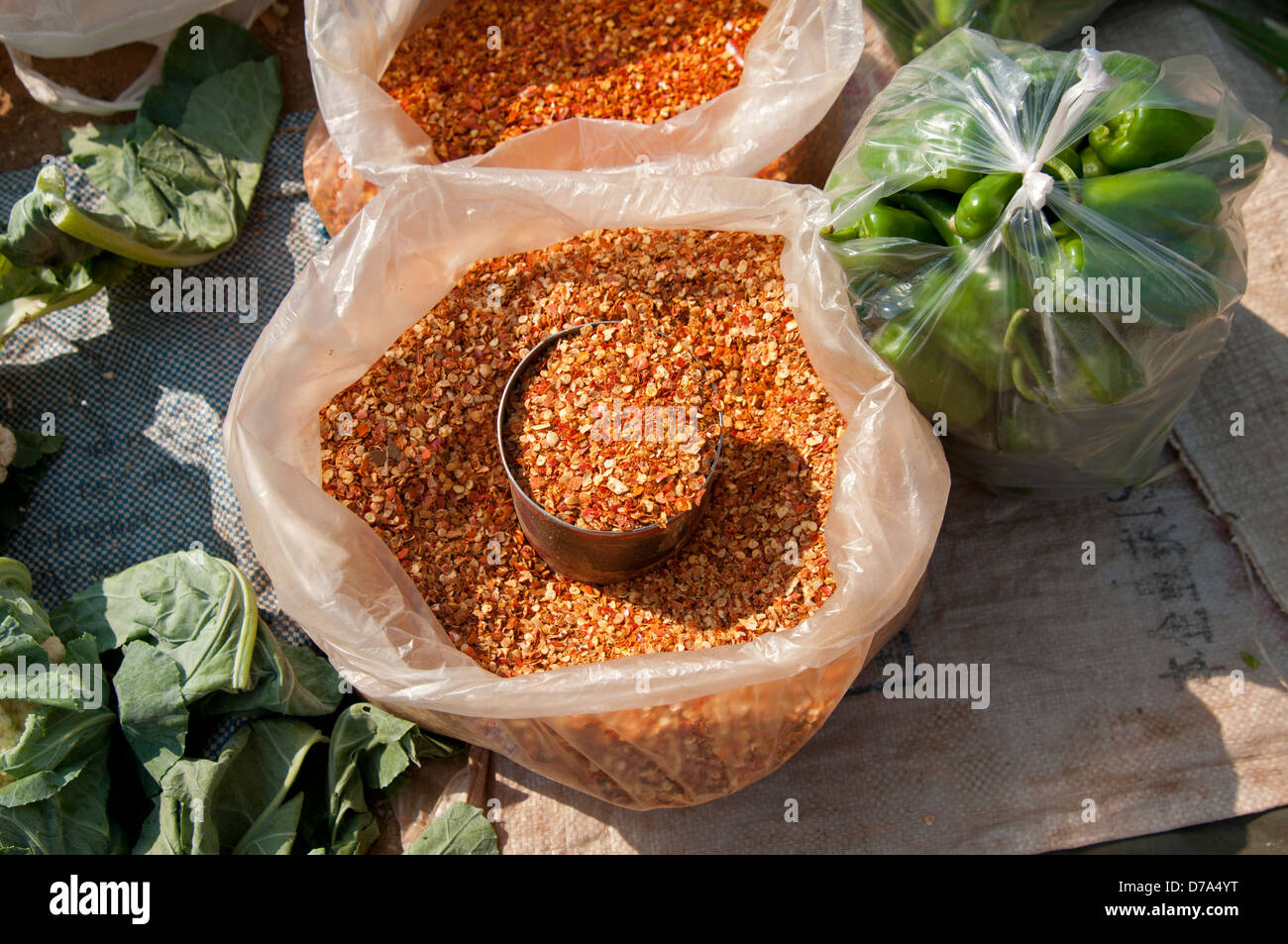 Large plastic bag of dried chilli flakes at Inthein market Inle lake ...
