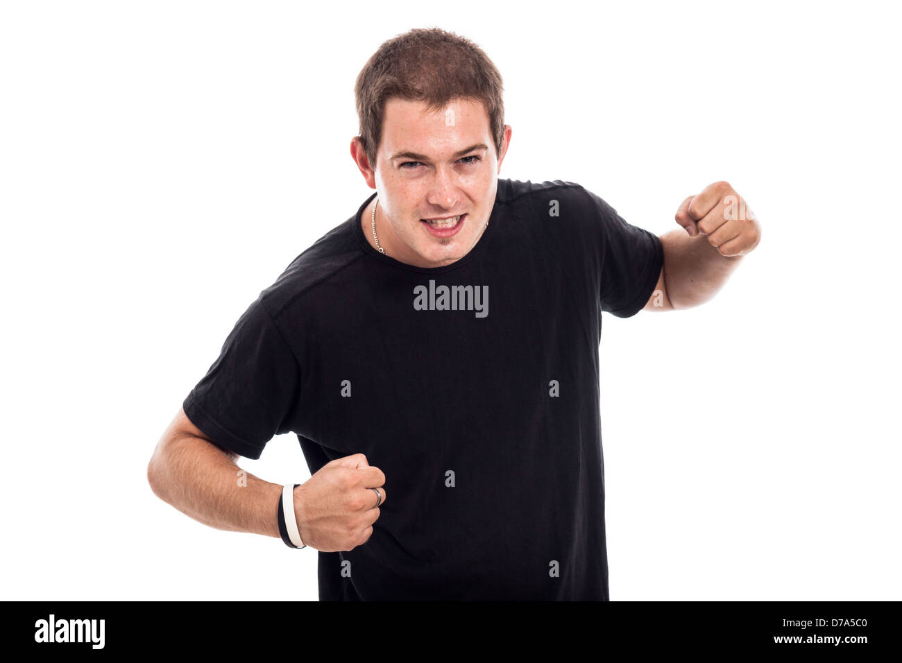 Young angry man attacking with fist, isolated on white background Stock ...
