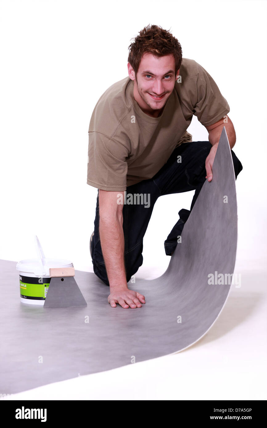 Man placing carpet Stock Photo - Alamy