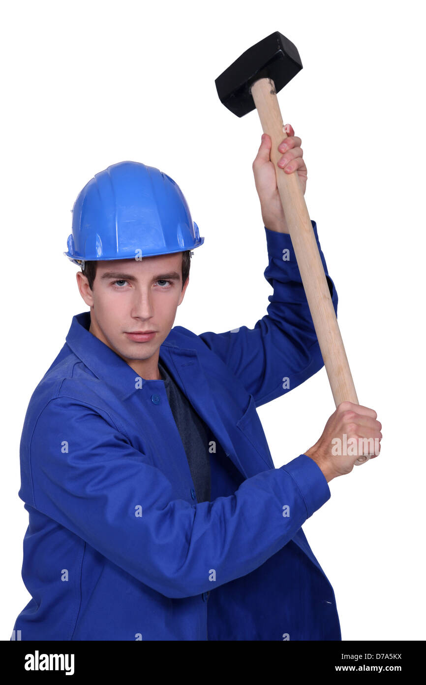 Man wielding sledge-hammer Stock Photo - Alamy Man wielding sledge-hammer Stock Photo - Alamy