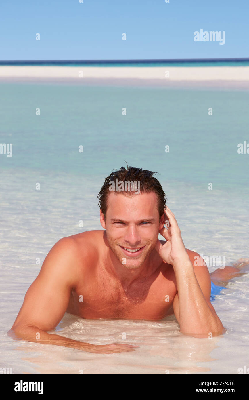Man Relaxing In Sea On Beach Tropical Beach Stock Photo - Alamy