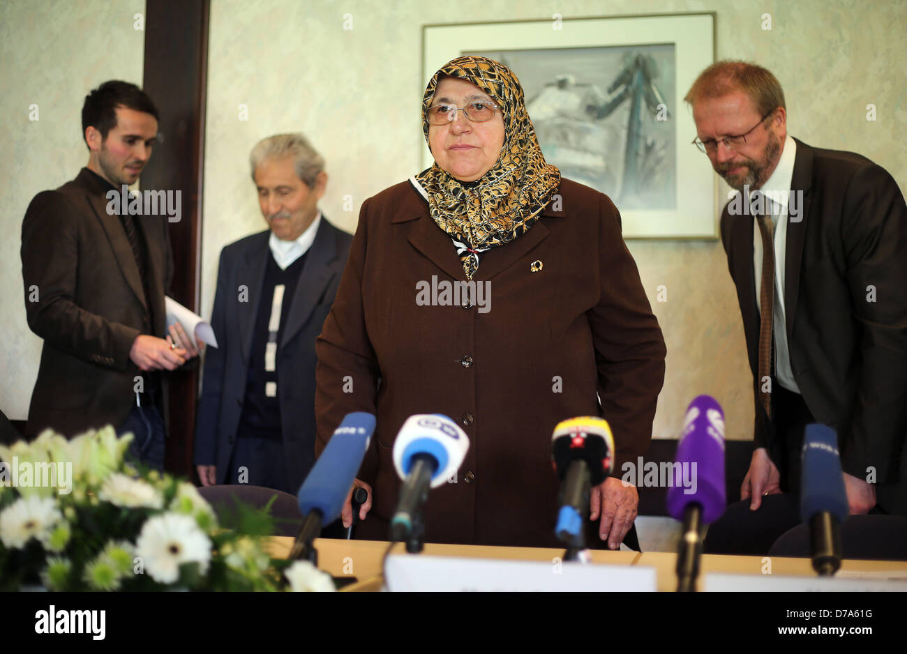 Mevlude Genc (C) and her husband Durmus (2-L) arrive for a press ...