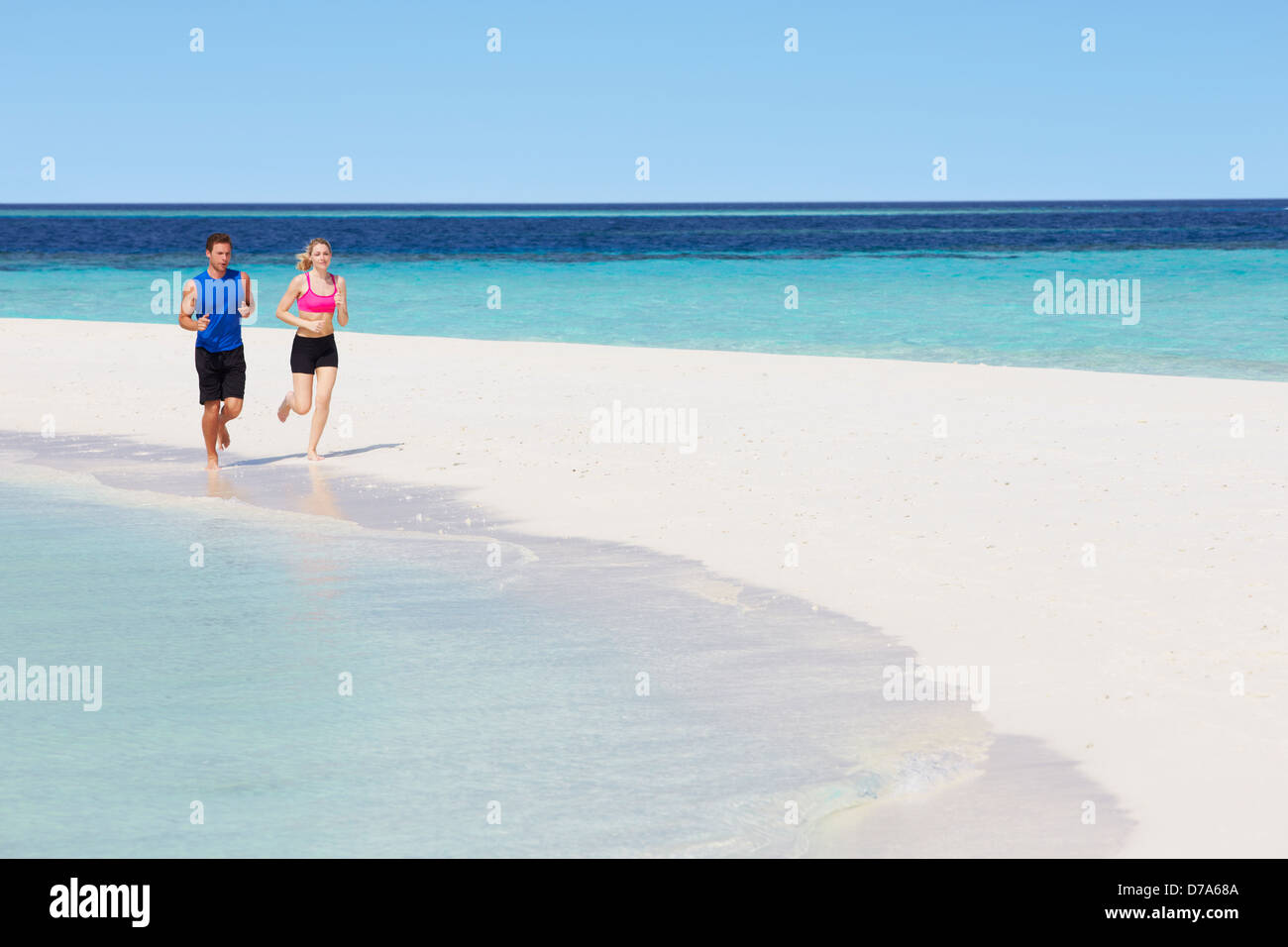 Sports woman running on beach hi-res stock photography and images - Alamy