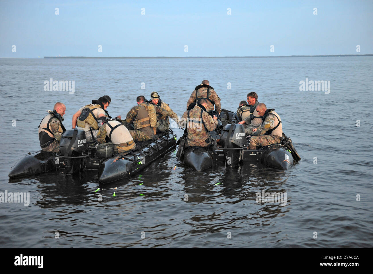 US special operations forces soldiers check equipment before insertion ...