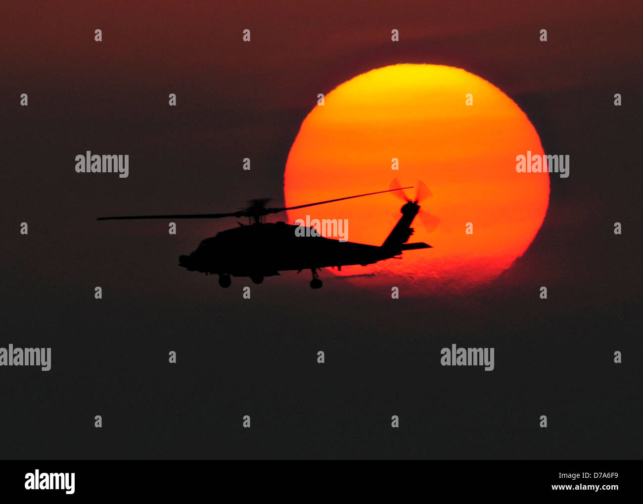 Seahawk helicopter flying in silhouette hi-res stock photography and ...