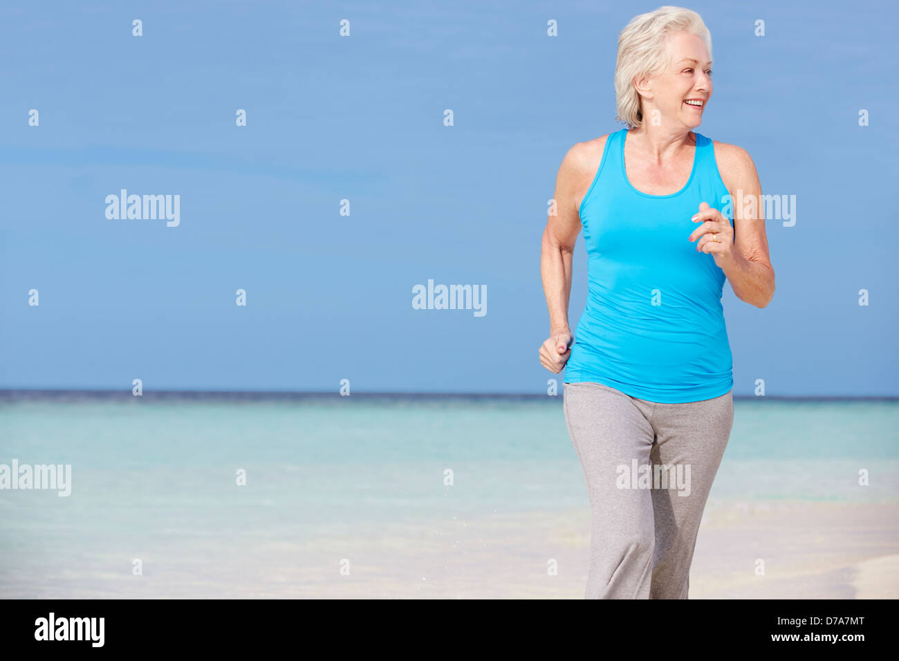 Sports woman running on beach hi-res stock photography and images - Alamy