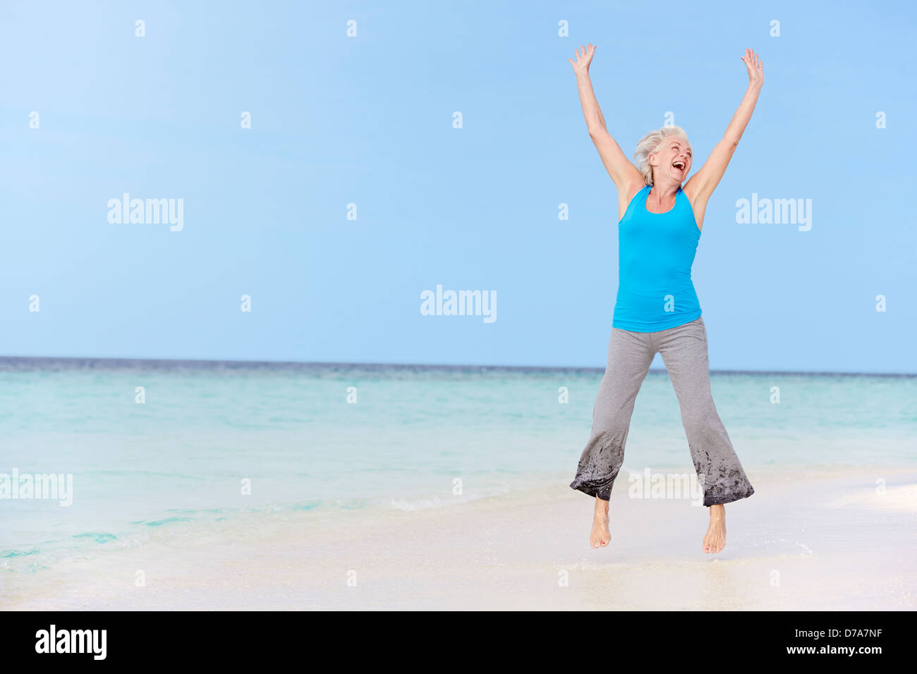 Fit woman jumping hi-res stock photography and images - Alamy