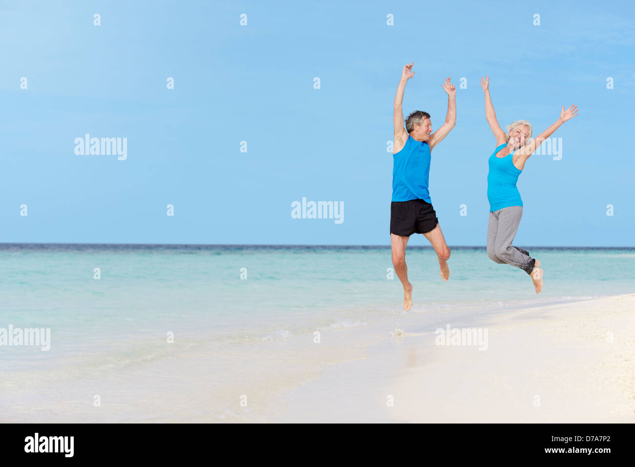 Happy Woman Jumping The Air On The Beach High Resolution Stock ...