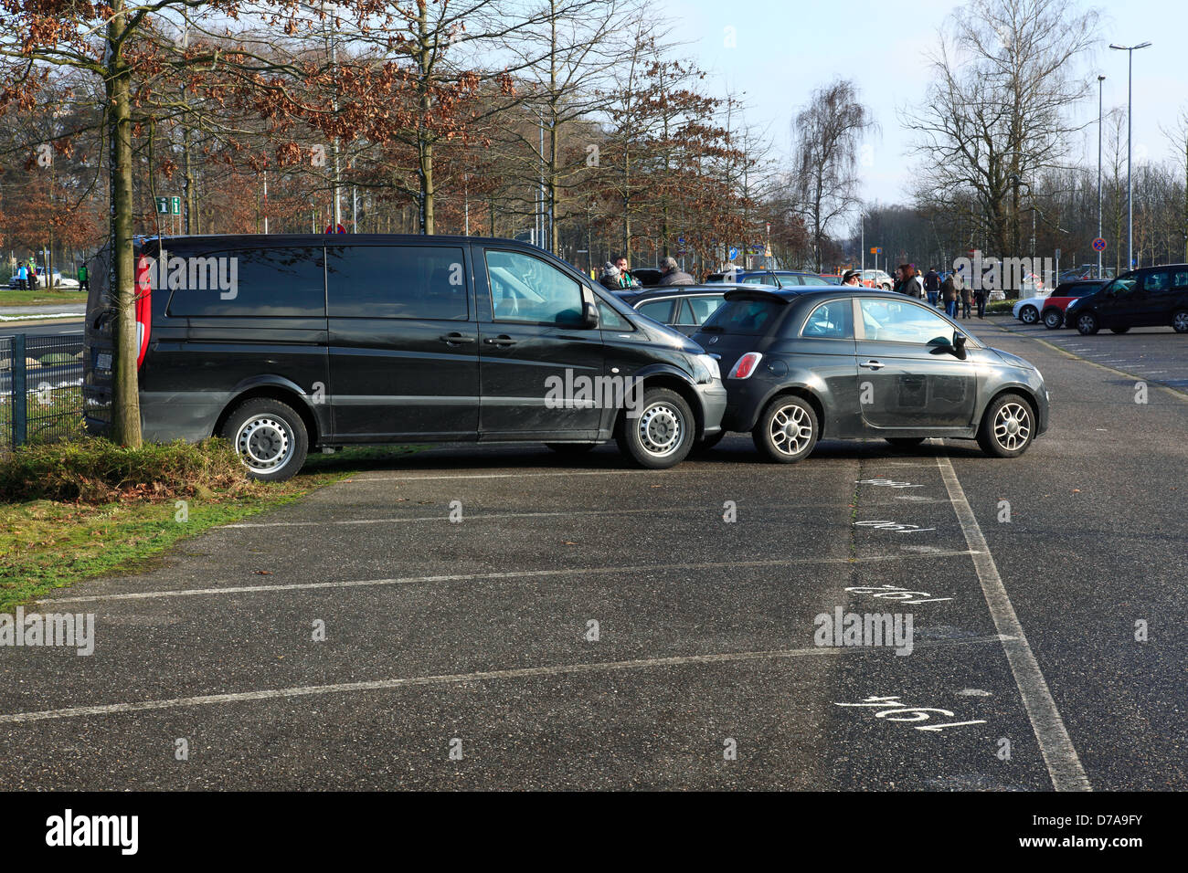 Car in two parking spaces hi-res stock photography and images - Alamy
