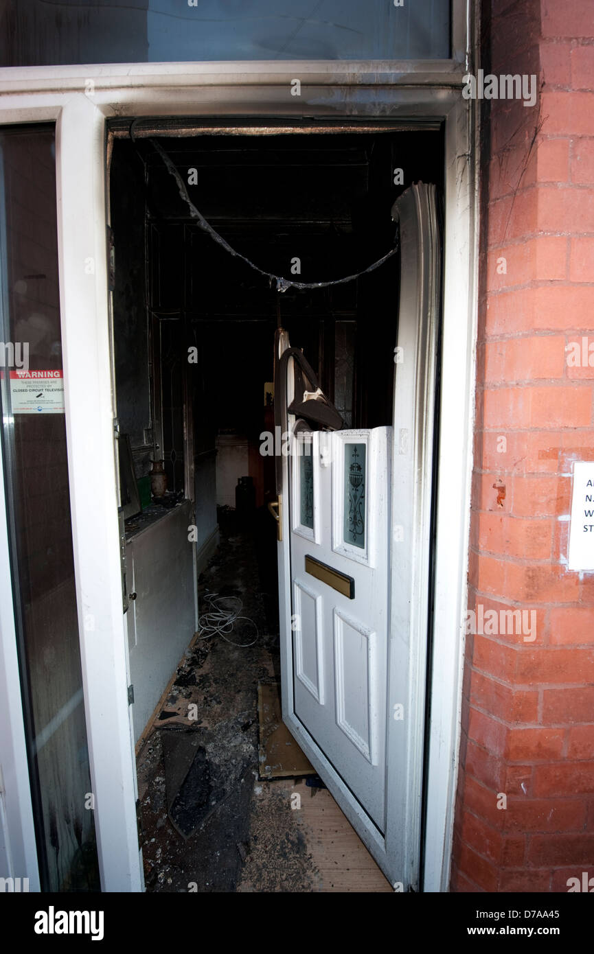 Severe house fire front door UPVC Burnt Melted Stock Photo - Alamy