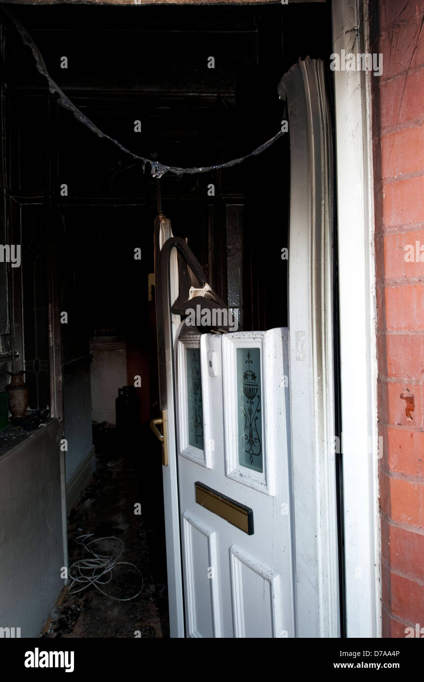 Severe house fire front door UPVC Burnt Melted Stock Photo - Alamy