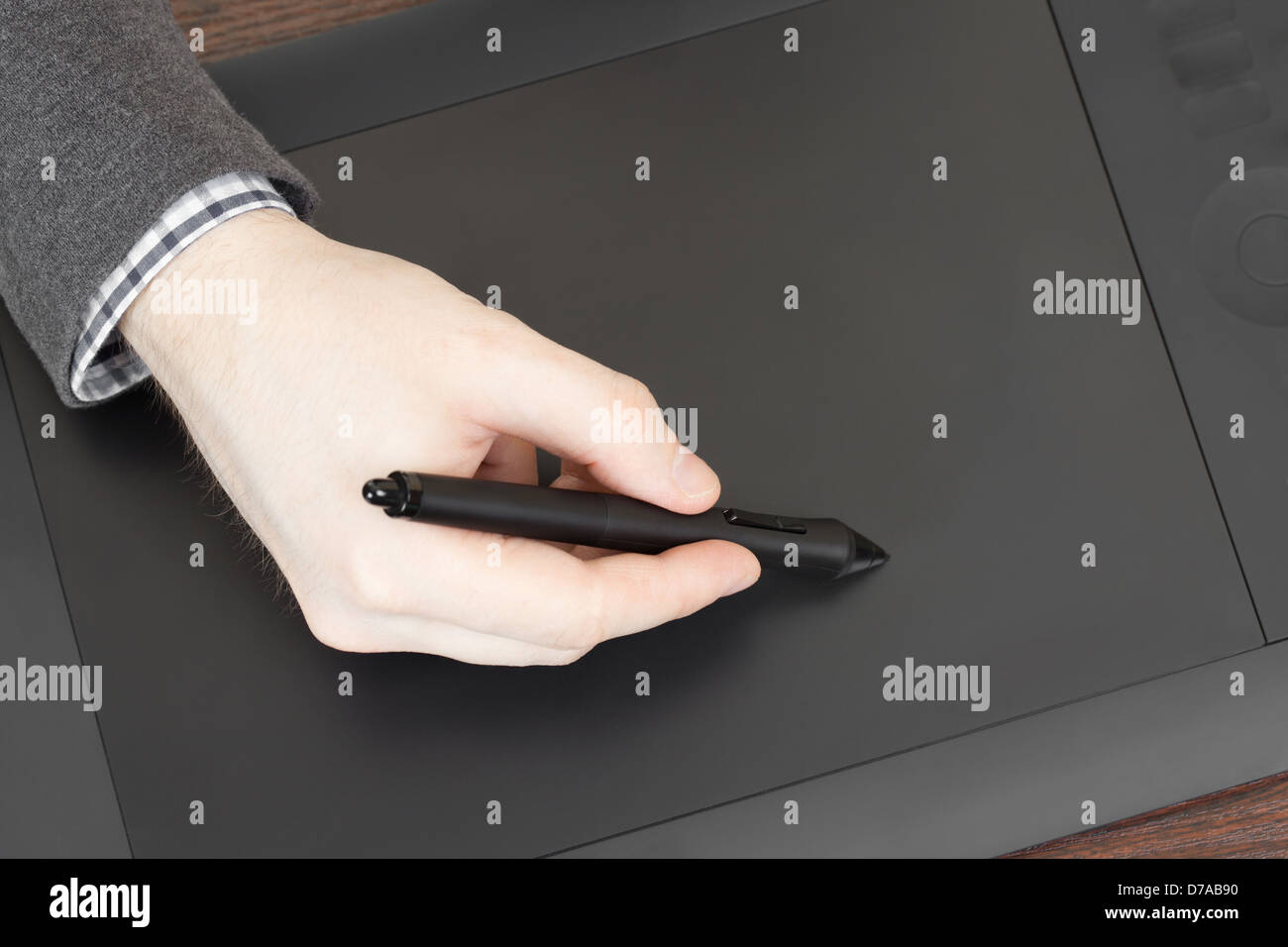 Man drawing something with help of professional graphic tablet and pen ...