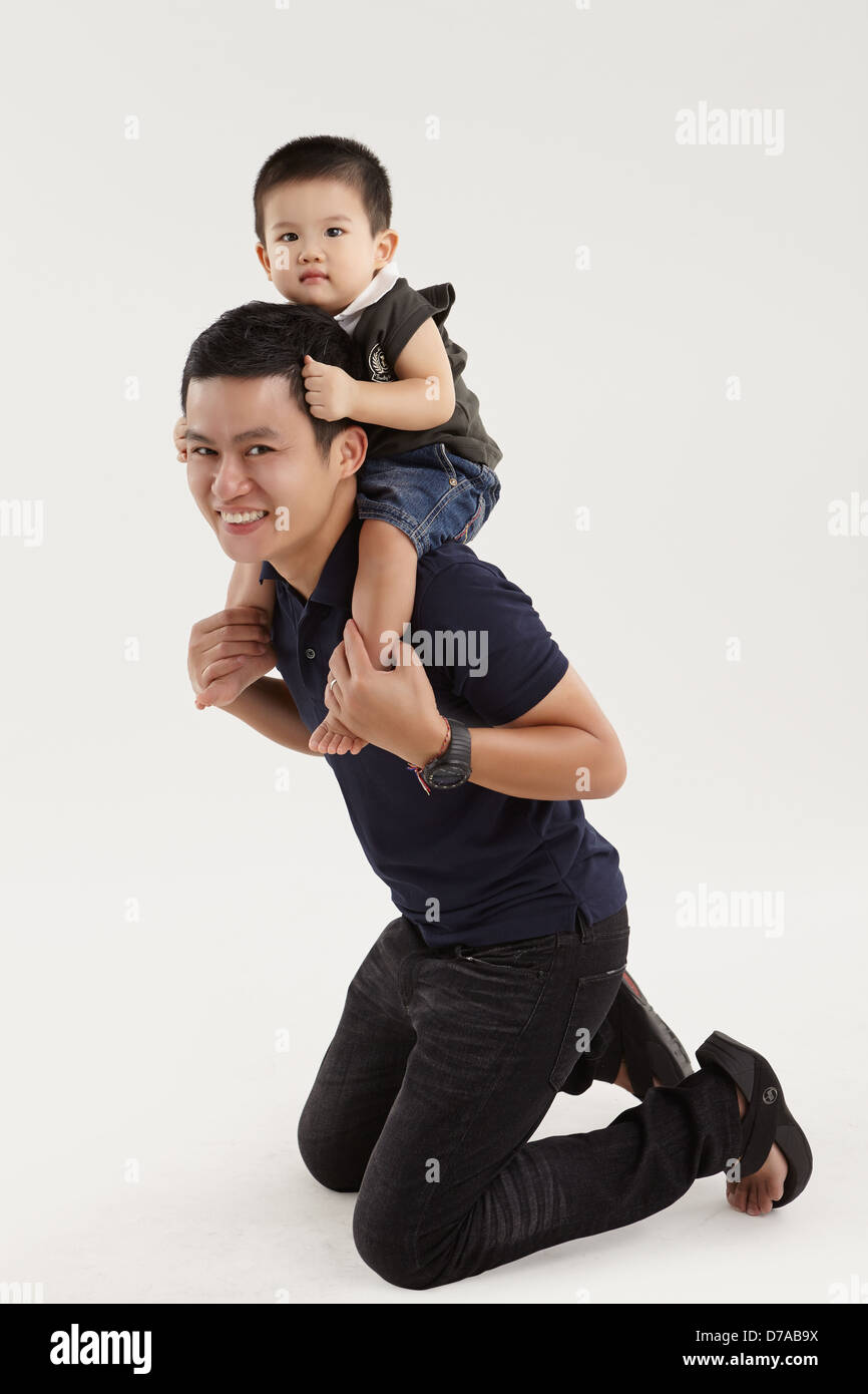 Child carry father hi-res stock photography and images - Alamy