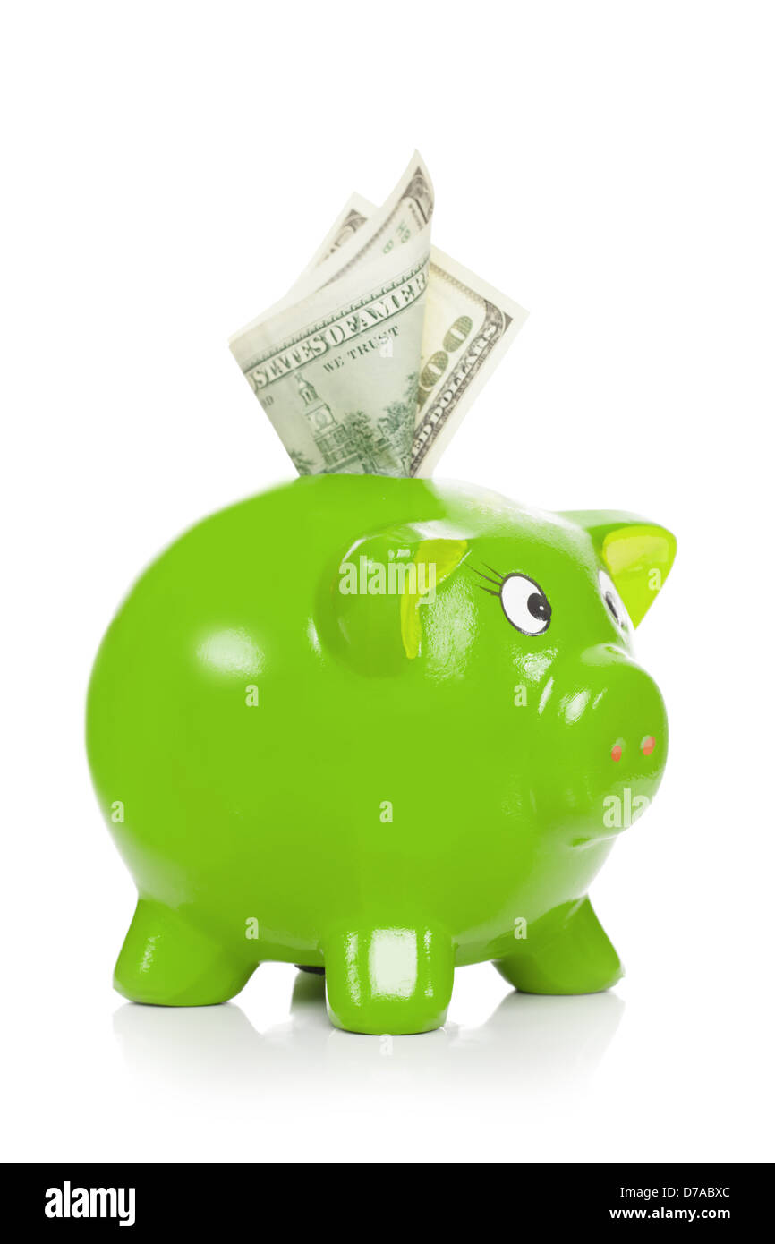 Green piggy bank with dollars sticking out - isolated on white ...