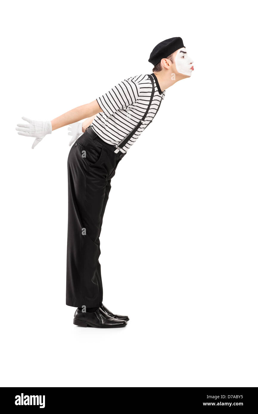 Full length portrait of a male mime artist gesture kissing isolated on ...
