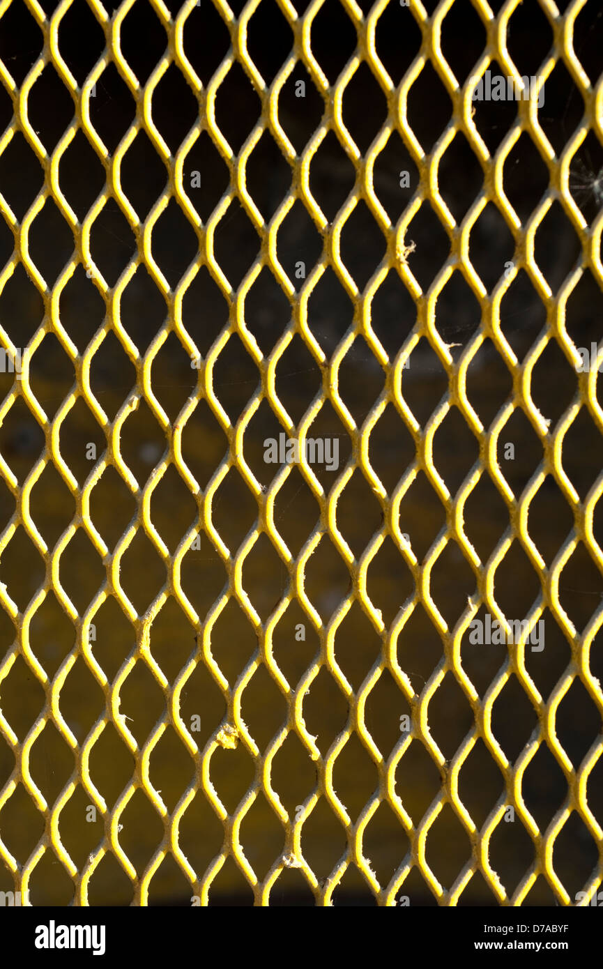 Yellow Steel fencing repetitive pattern background Stock Photo - Alamy