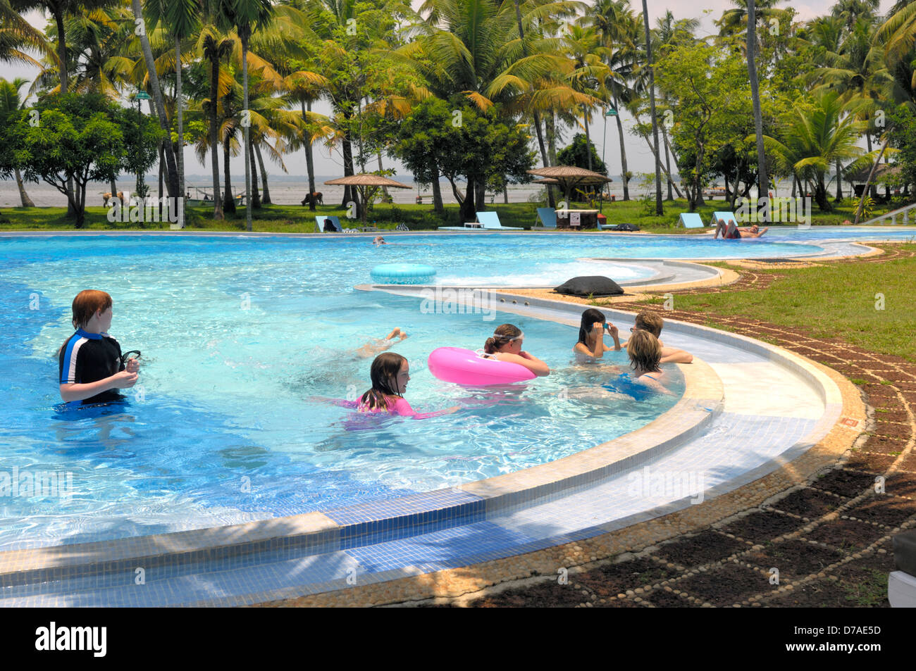 Children in swimming pool CGH Earth Coconut Lagoon resort, Kerala ...