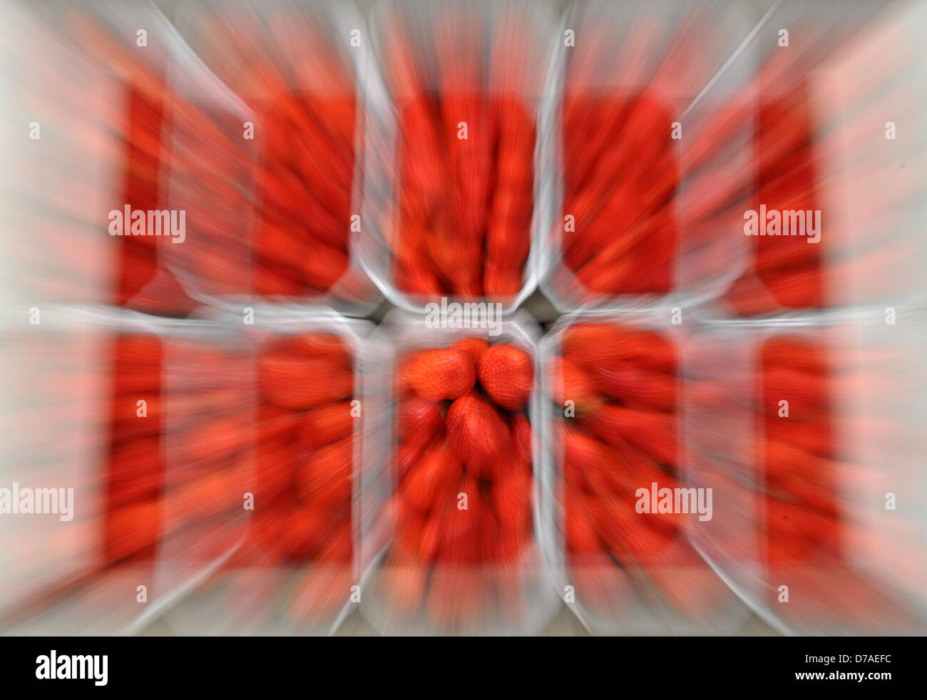 Baskets of strawberries sit in a crate at a strawberry farm in ...