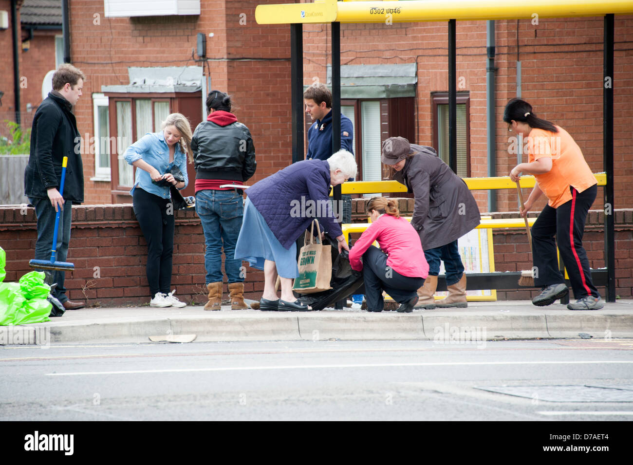 Residents cleaning streets after riot Liverpool Stock Photo - Alamy